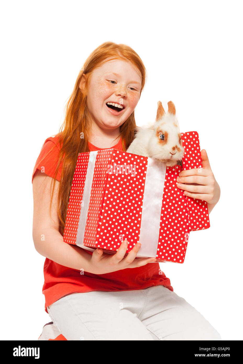Red hair girls receive rabbit as present Stock Photo - Alamy