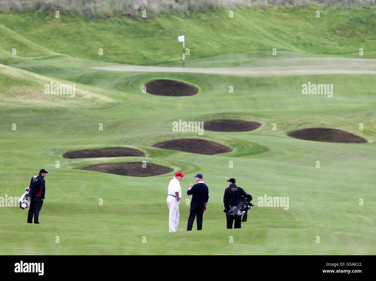 Donald Trump chats with Sandy Jones, chief executive of the PGA as they ...