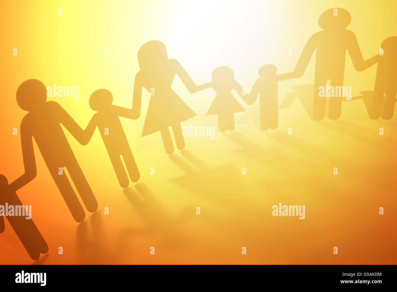 Family paper chain cutout holding hands Stock Photo - Alamy