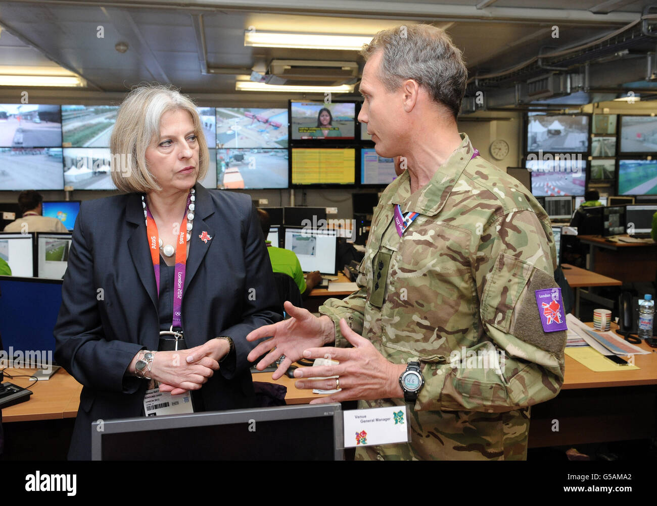 Theresa May meets Colonel Gary Wilkinson as she views the Olympics ...