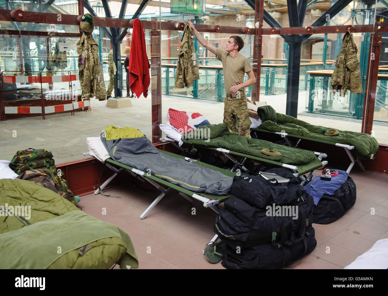 A soldier in sleeping quarters at temporary Army barracks at Tobacco ...