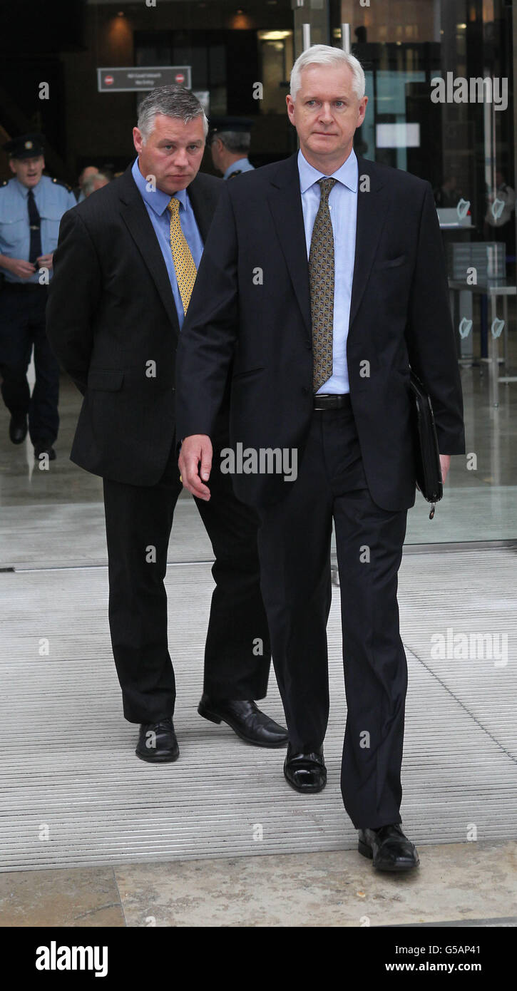 Garda Superintendent Eamon Keogh (right) leaves Dublin District Court ...