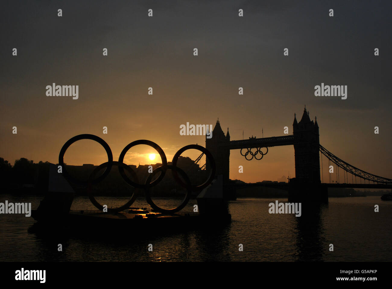 Sunrise over Tower Bridge and the Olympic Rings in central London this ...