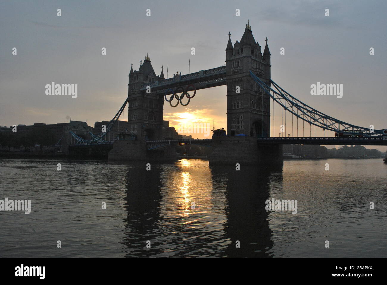 Sunrise over Tower Bridge and the Olympic Rings in central London this ...