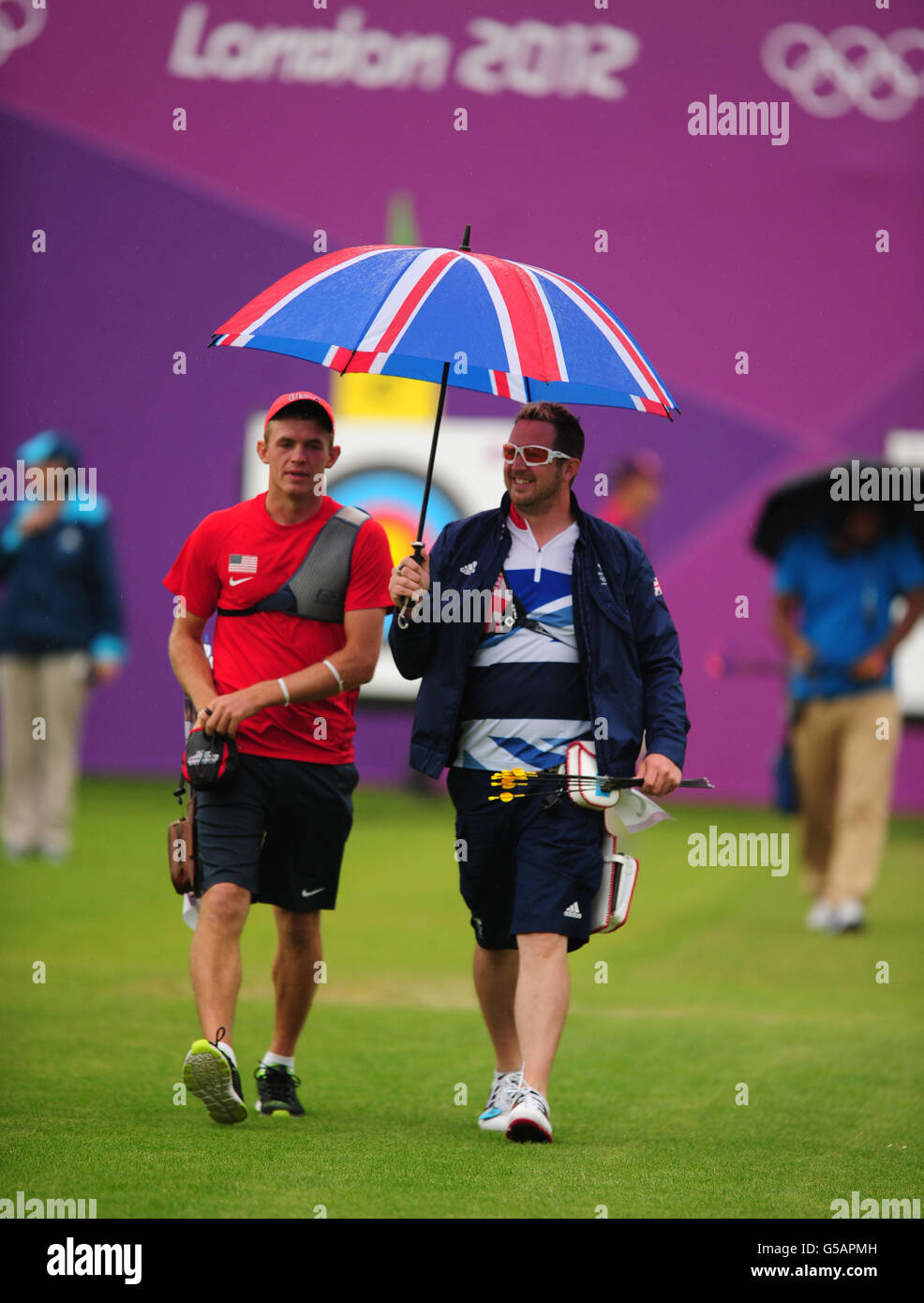 Great Britain's Larry Godfrey (right) walks back to his shooting ...