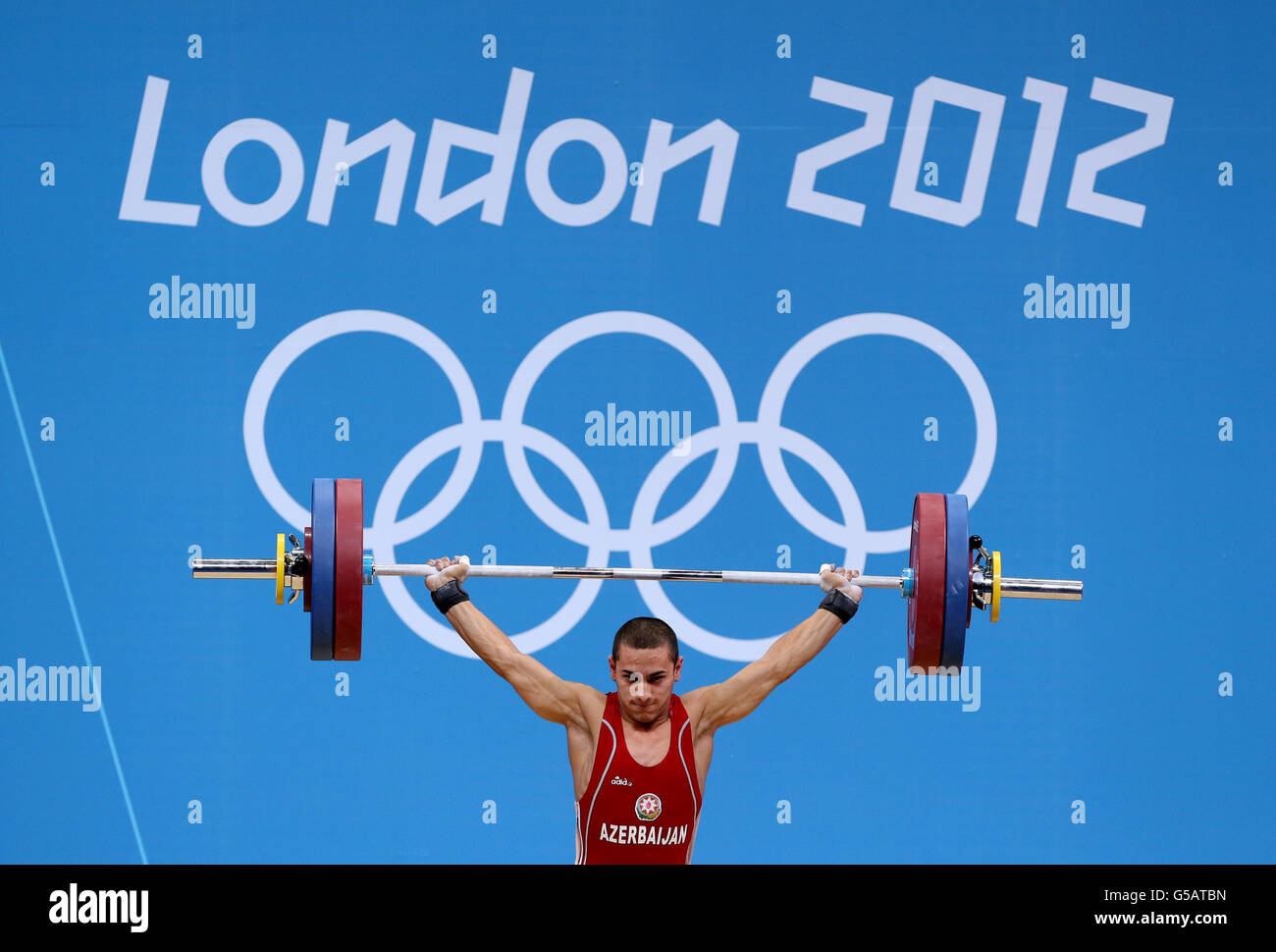 Azerbaijan's Valentin Hristov in action in the men's 56kg weightlifting ...