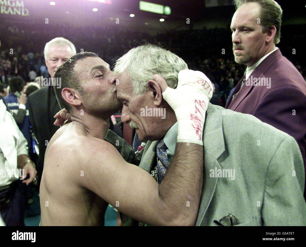 Prince Naseem Hamed (left) kisses his father Sal after losing on points ...