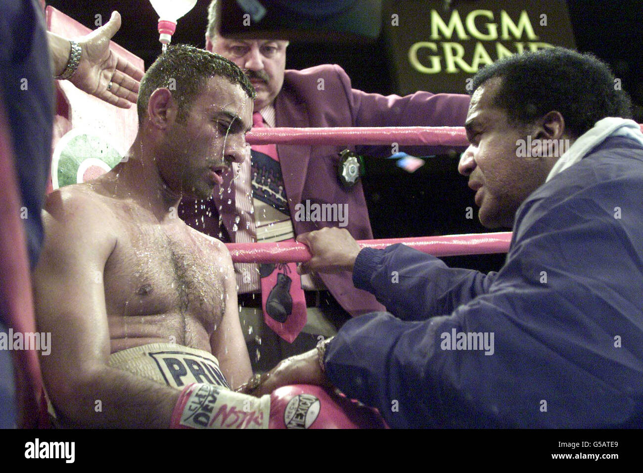 Manny Steward (right) tries to gee Prince Naseem Hamed up after losing ...