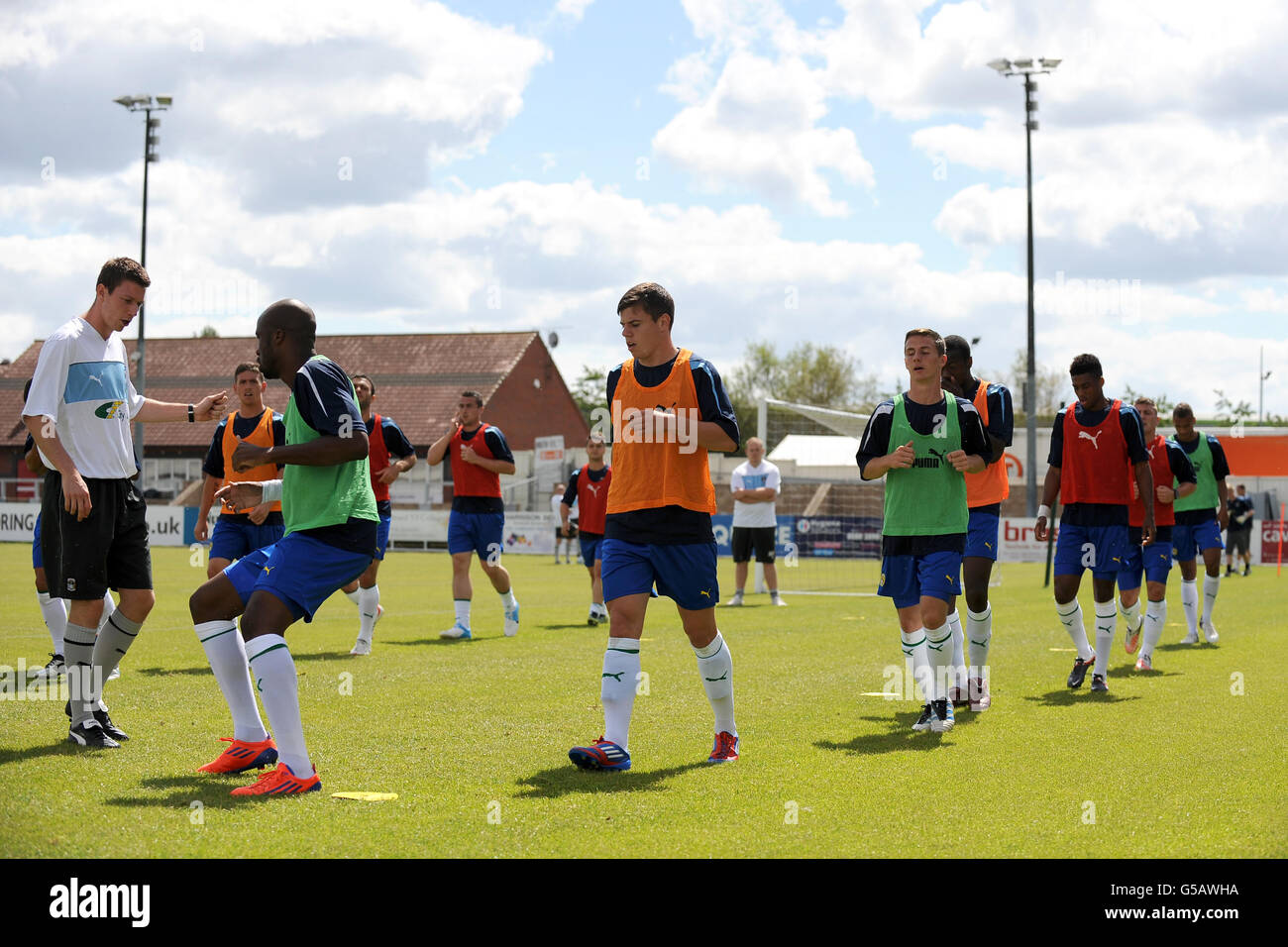 Coventry City assistant physiotherapist Sam Heathcote (left) oversees ...