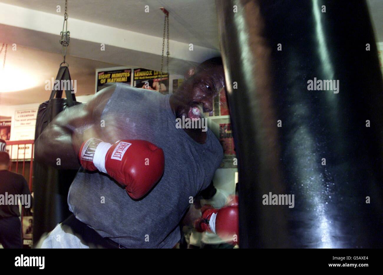 Heavyweight boxer Hasim Rahman trains on the heavy punchbag at Nick ...