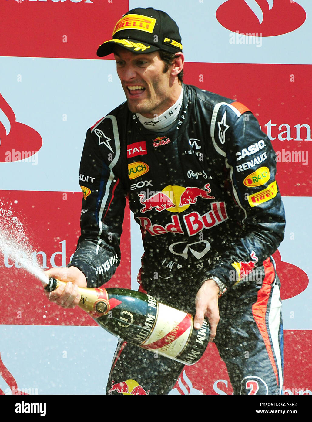 Red Bull Racing's Mark Webber sprays champagne after winning the ...