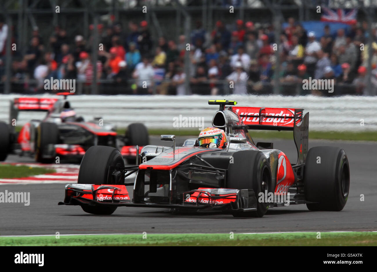 Vodafone Mclaren Mercedes' Lewis Hamilton leads his team mate Jenson ...