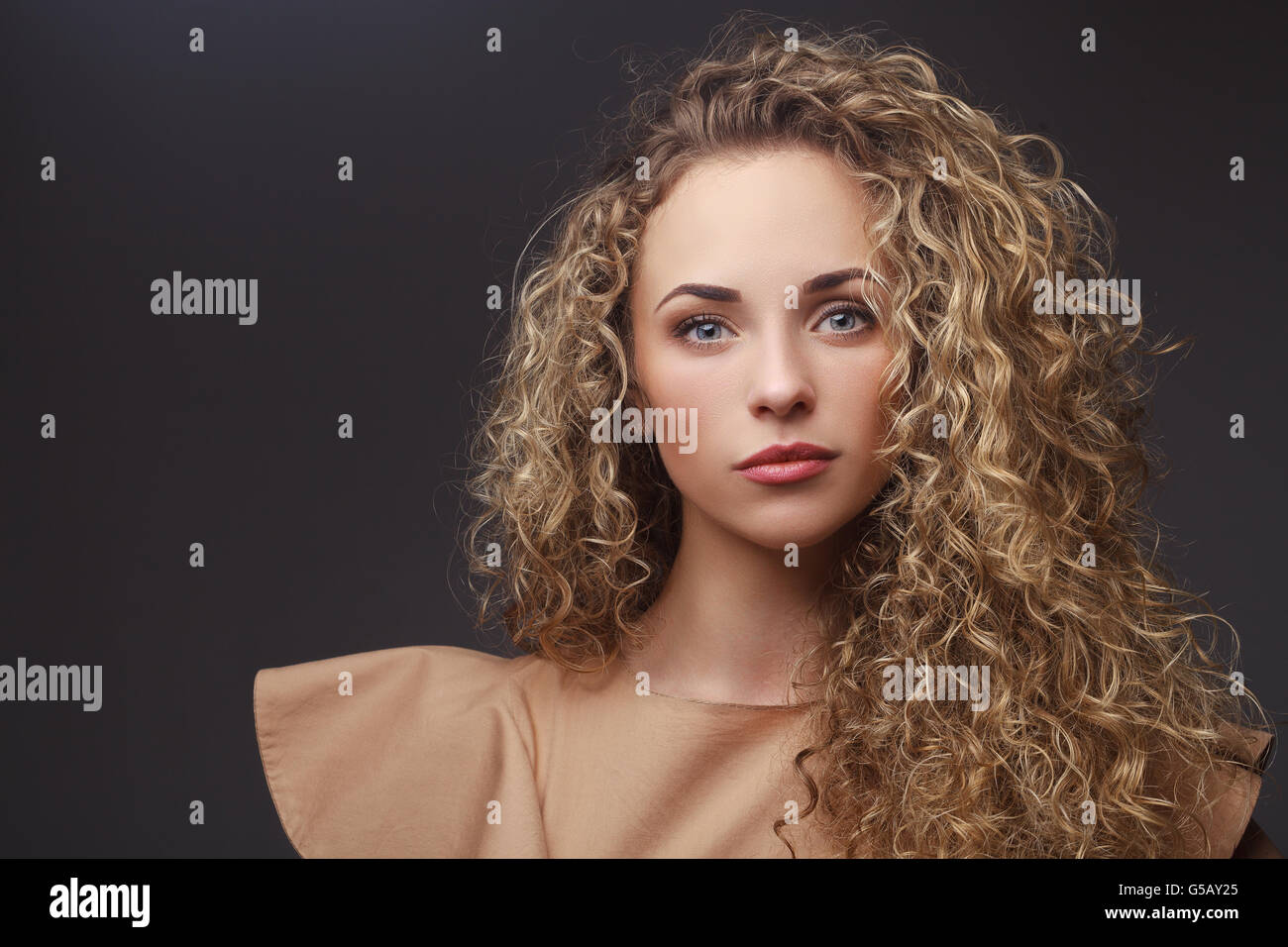 Portrait of perfect woman with curly hair Stock Photo - Alamy