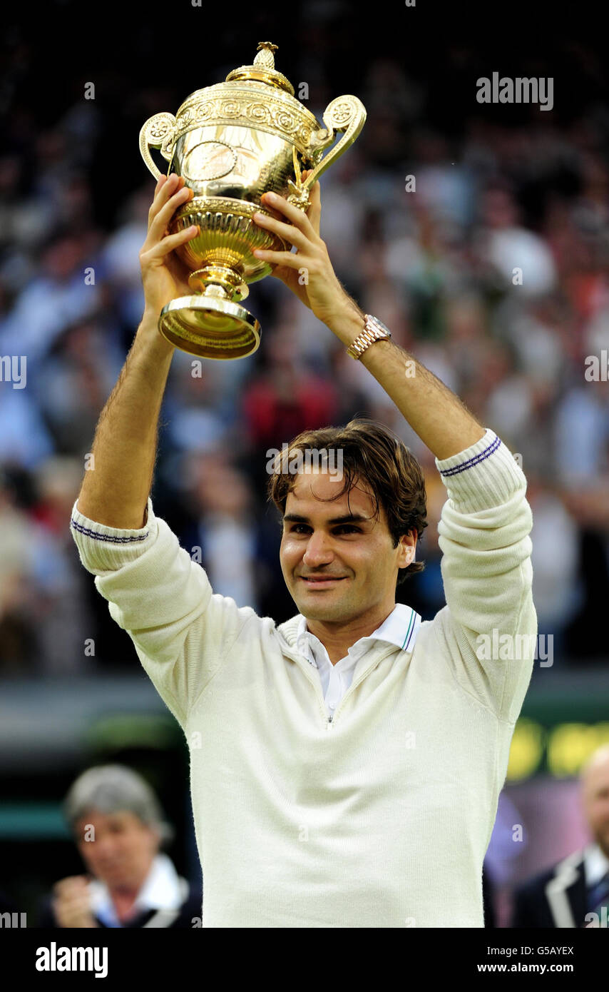 Switzerland's Roger Federer lifts the trophy after defeating Great ...