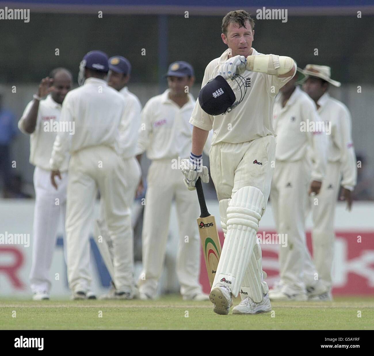 England's Robert Croft returns to the pavilion as the Sri Lankans ...