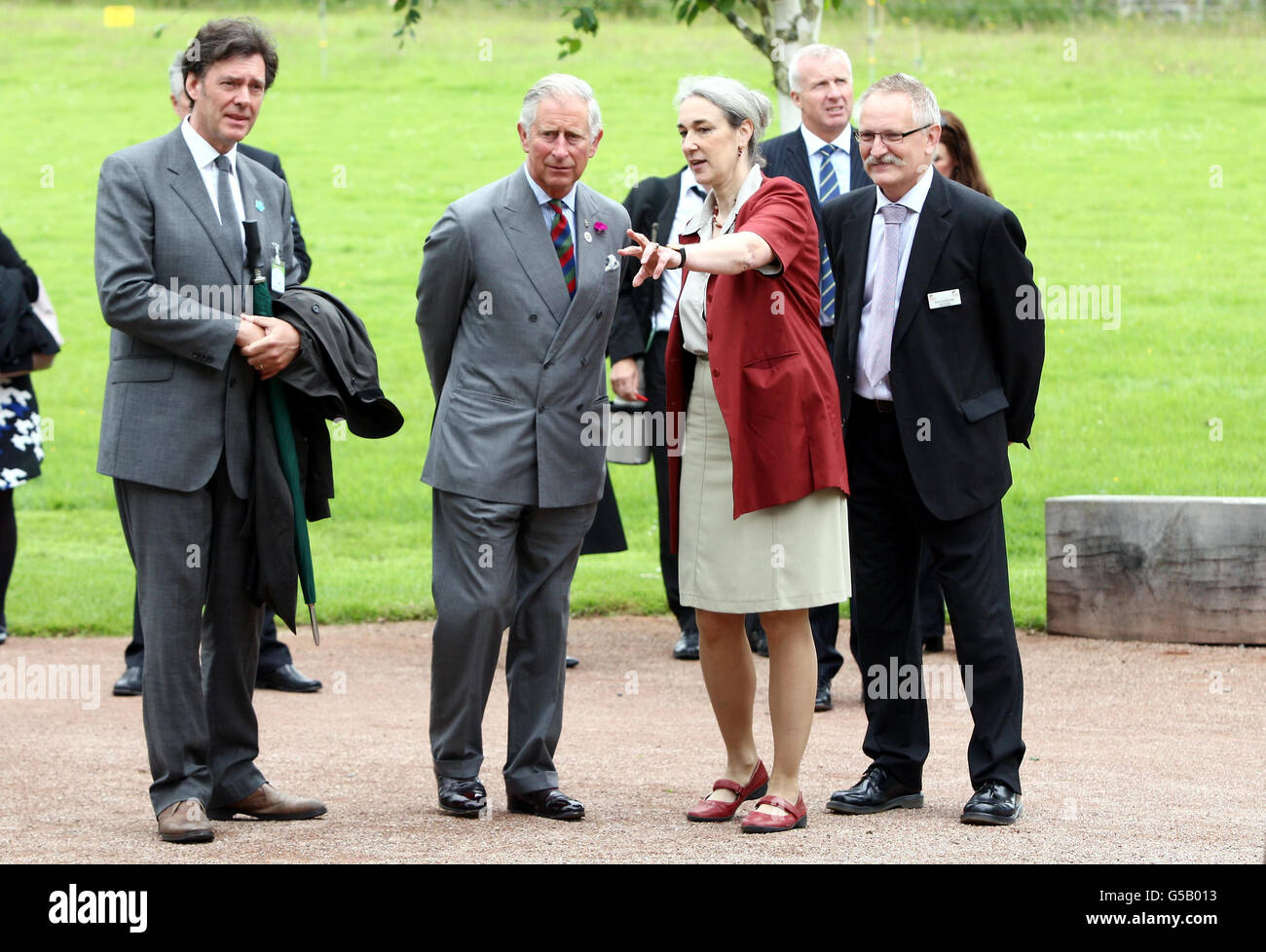 Director Dr Rosie Plummer (2nd right) shows Prince Charles around ...