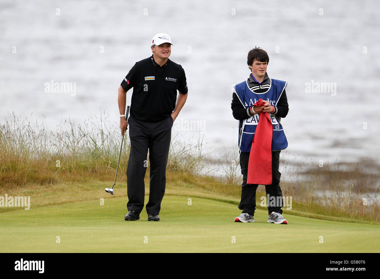 Scotland's Paul Lawrie and his son, Craig who is caddying for him ...
