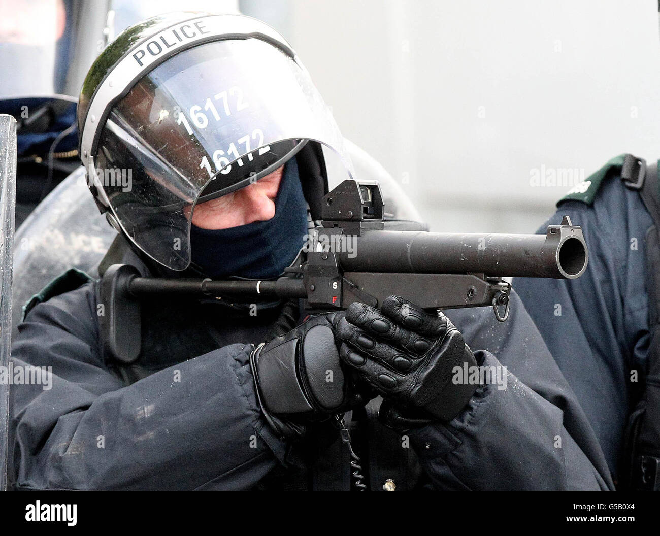 Ulster orange plastic bullet baton round aep impact round gun hi-res ...