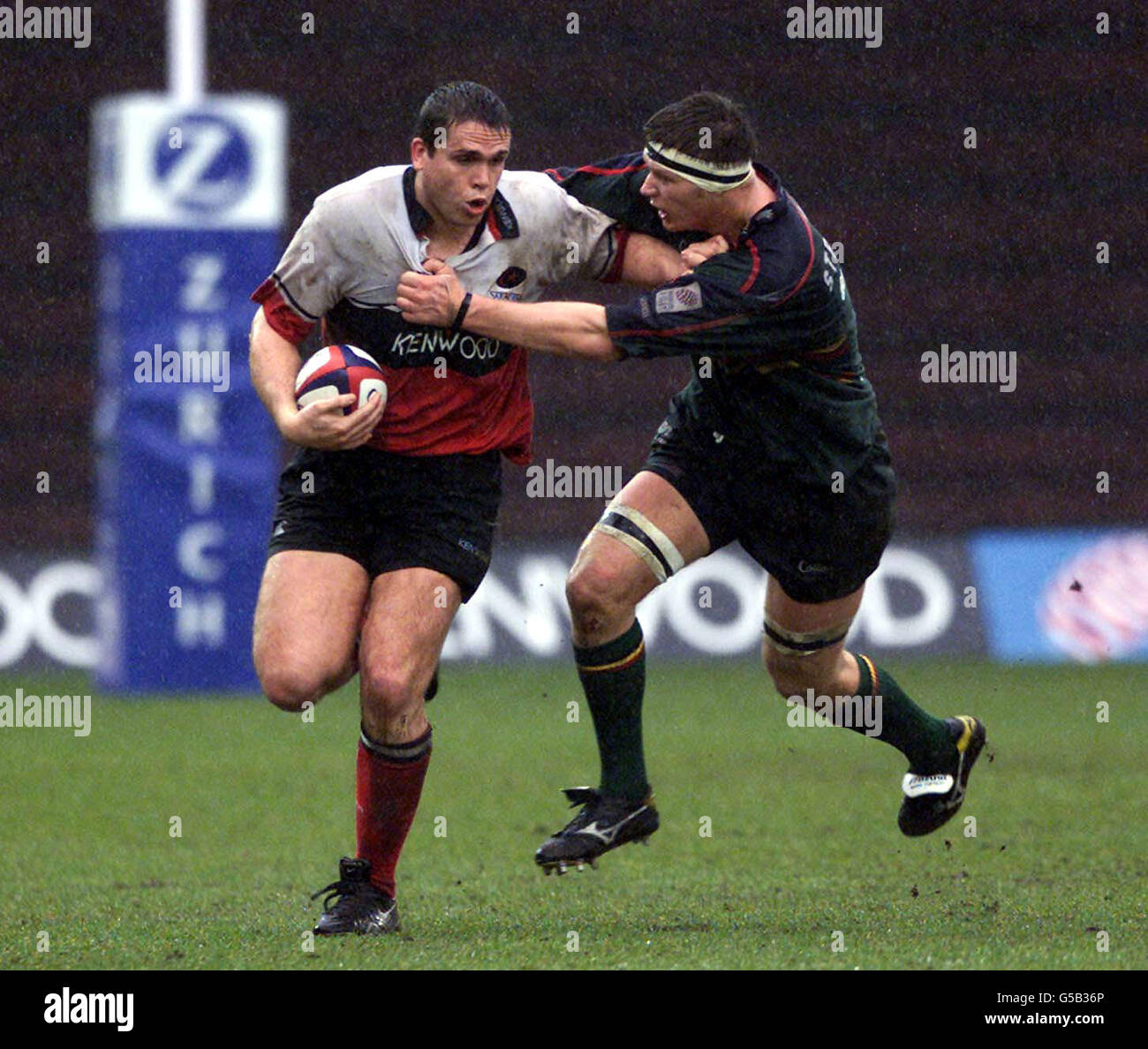 Saracens's Tony Diprose (left) holds off London Irish's Ryan Strudwick ...