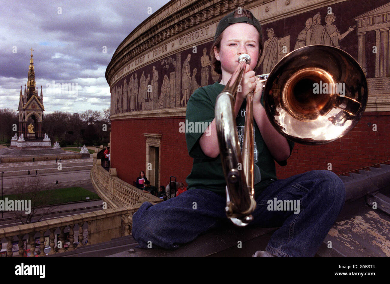 Eight year old Barney Taube plays his trombone by the Dome of the Royal ...