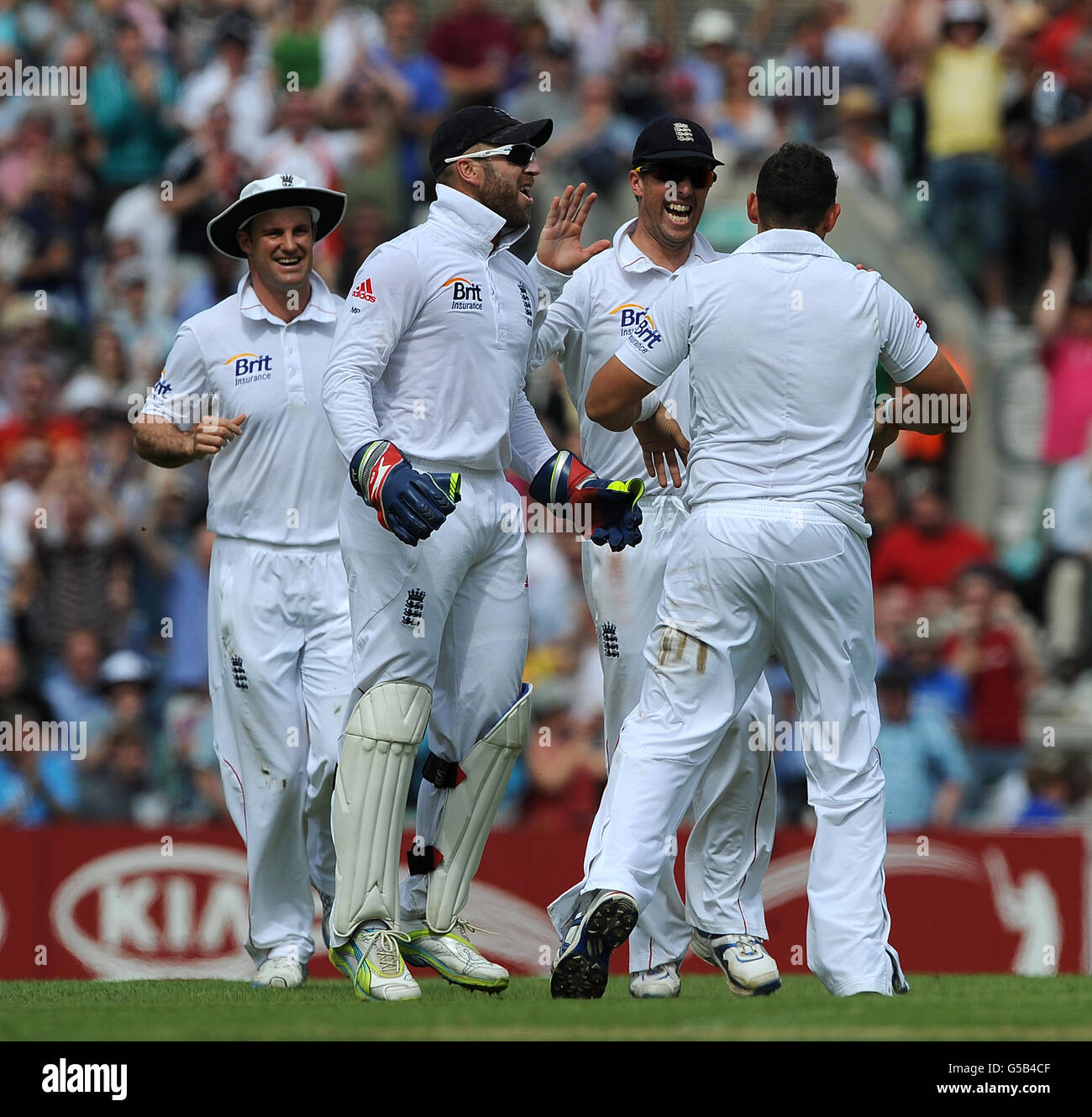 Englands swann celebrates taking the wicket of south africas smith hi ...