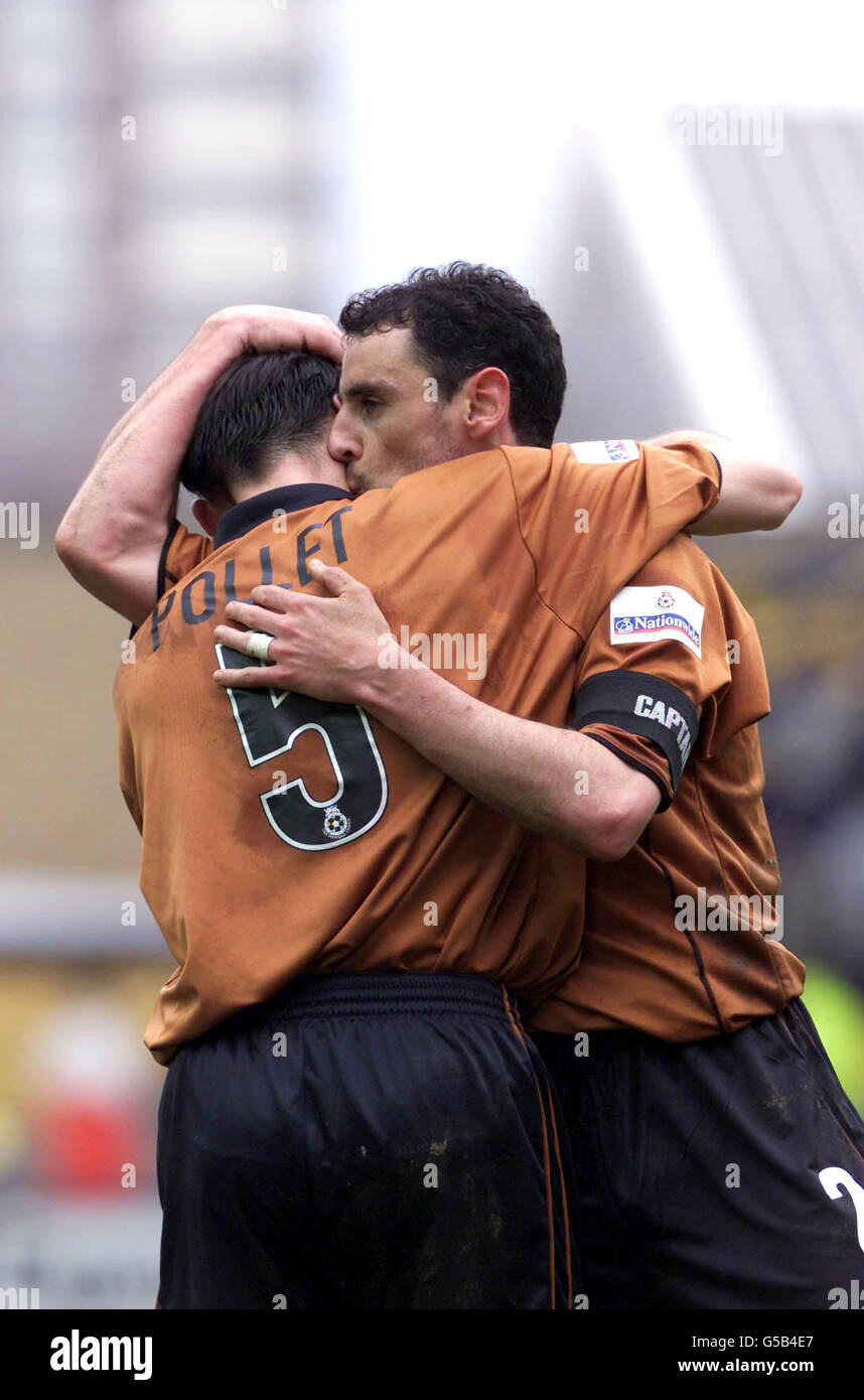 Wolverhampton Wanderers captain Kevin Muscat (right) hugs team mate ...