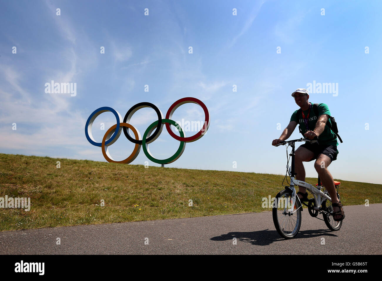 Ireland's coach Adrian Cassidy passes the Olympic rings as he follows ...