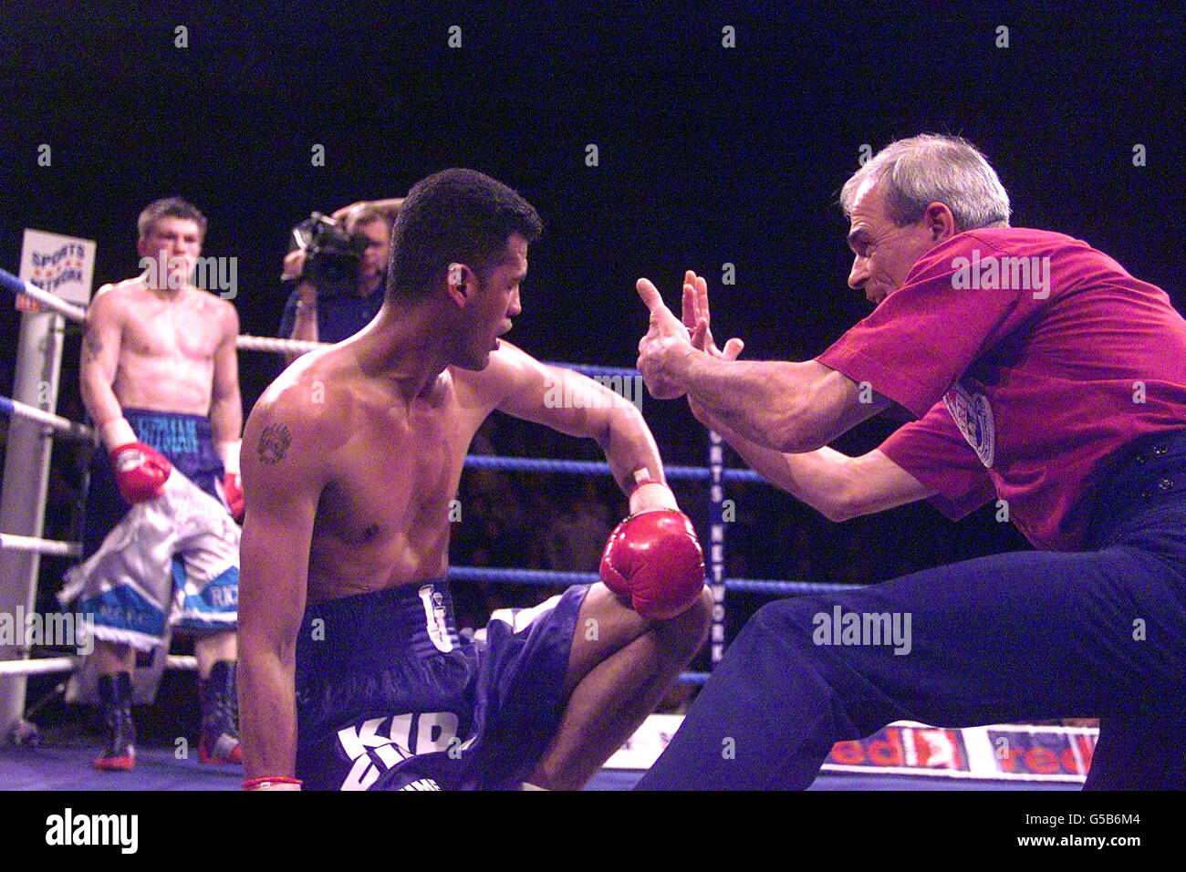 Canada's Tony Pep (centre) takes a count in the third round as Ricky ...
