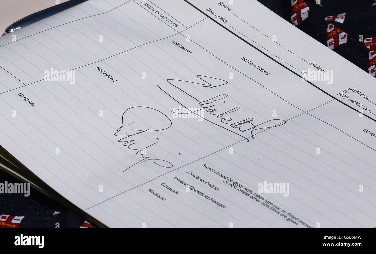 Queen Elizabeth II and the Duke of Edinburgh's signatures are written ...