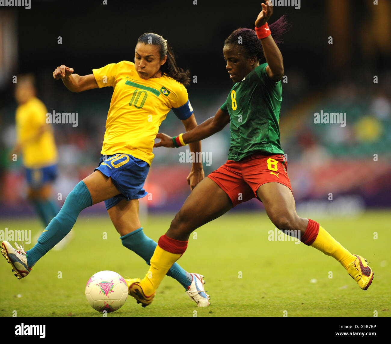 Brazil's Marta (let) and Cameroon's Raissa Feudjio battle for the ball ...