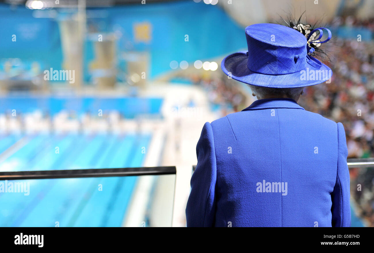 Queen Elizabeth II watches the morning session of the swimming at the ...