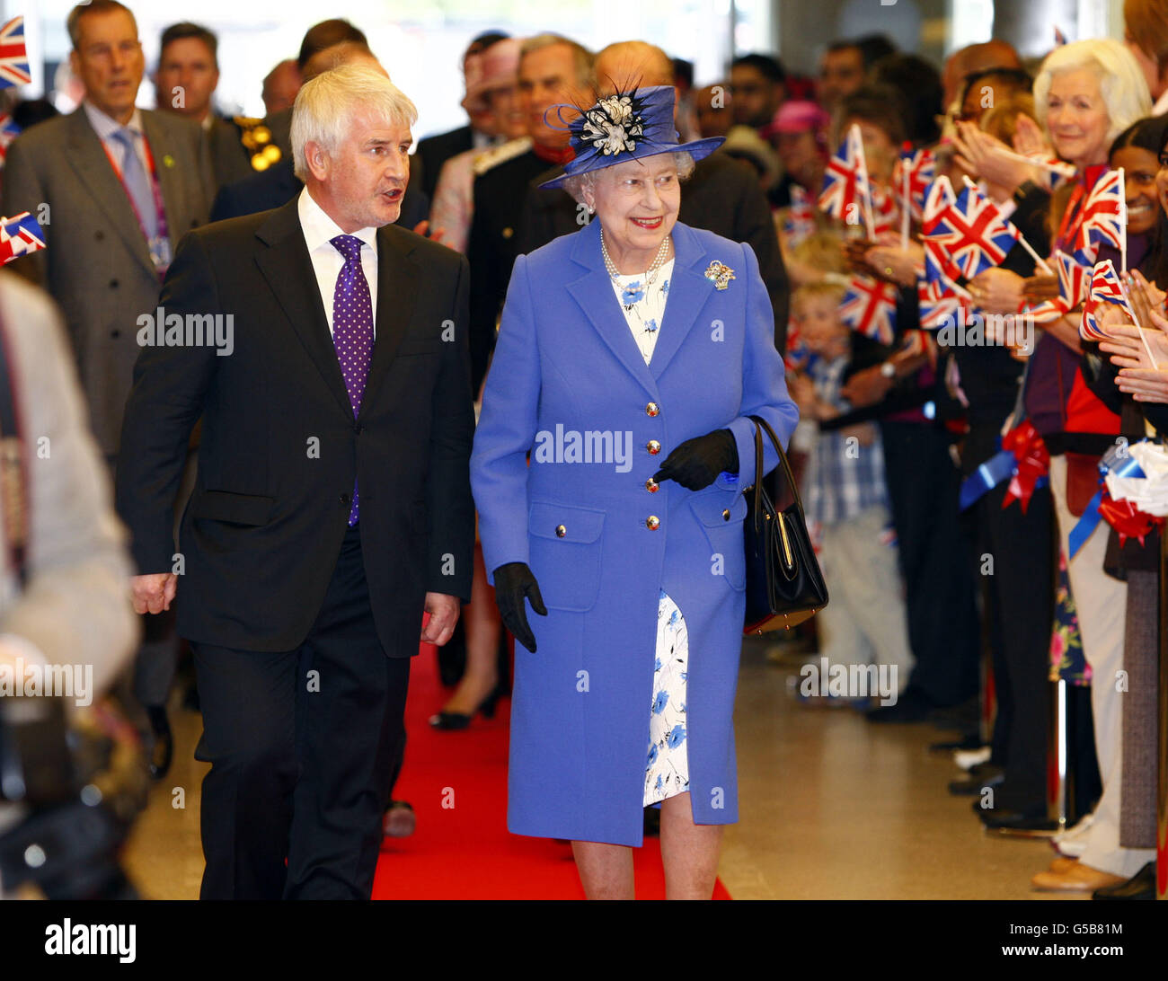Queen Elizabeth II with city airport chief Executive Declan Collier ...