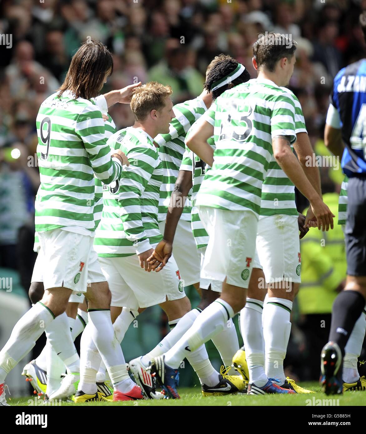 The Celtic players celebrate after Kris Commons (second left) scored ...