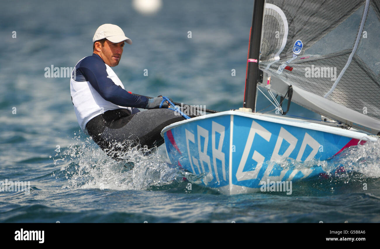 Great Britain's Ben Ainslie practices in his Finn dinghy on Weymouth ...