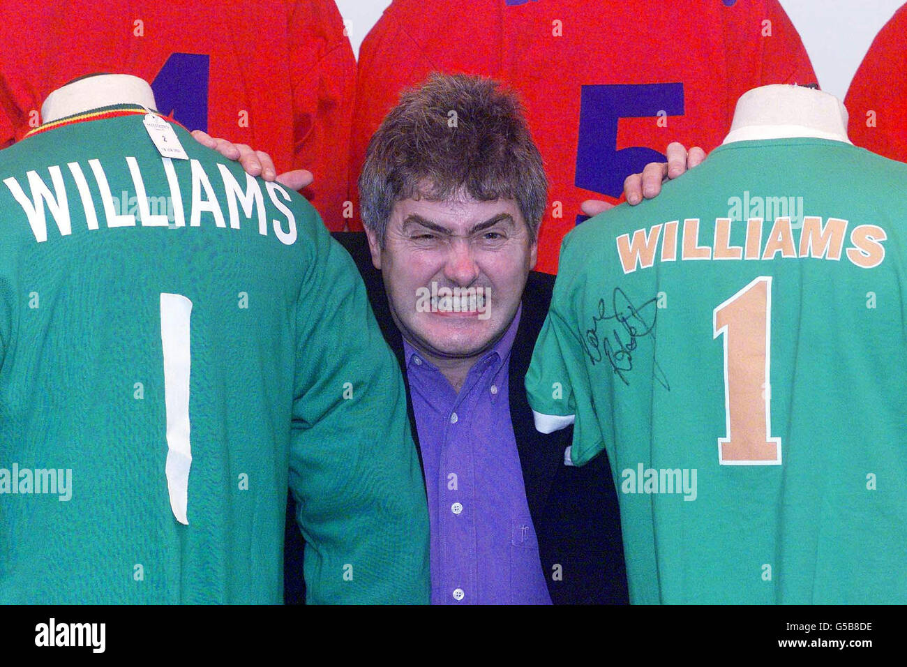 TV presenter Nick Hancock with pop singer Robbie Williams' football ...