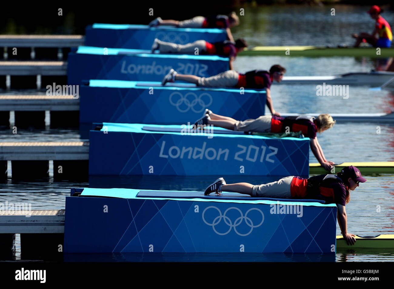 London Olympic Games - Day 1. Starters prepare boats at the starting ...