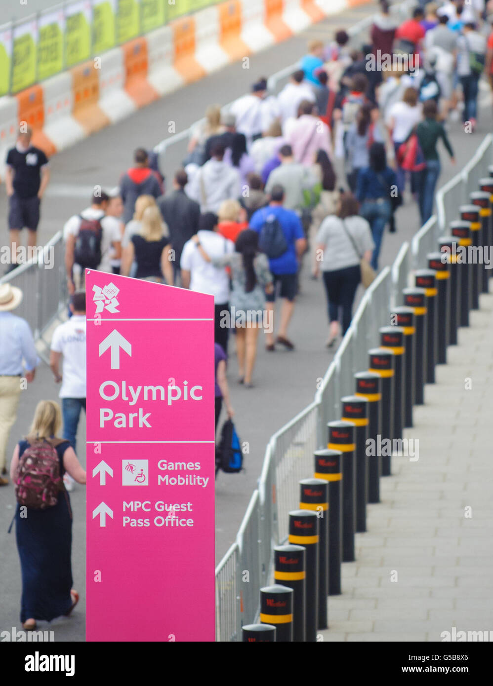 London Olympic Games - Day 1. Spectators follow signs directing them ...