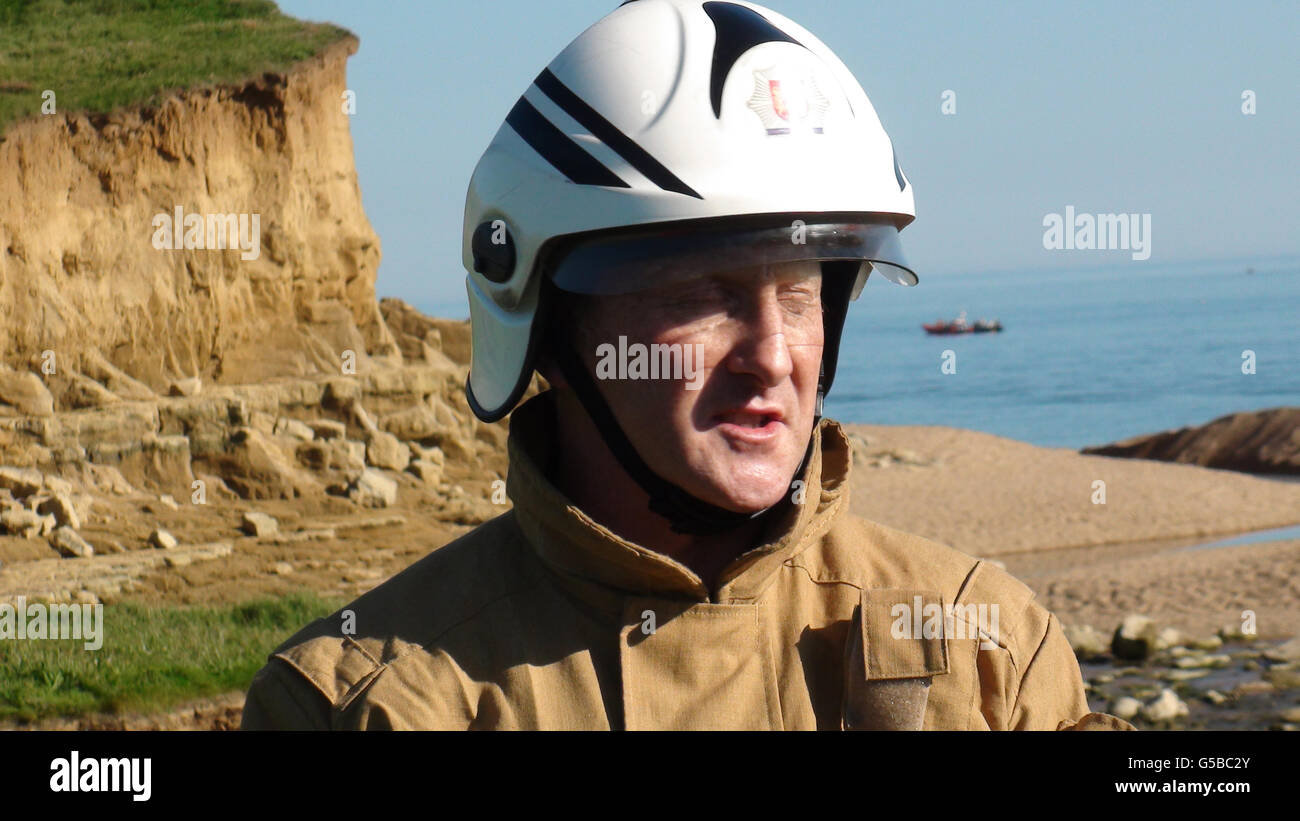 Group Manager Mick Stead, of Dorset Fire and Rescue Service, speaks to ...