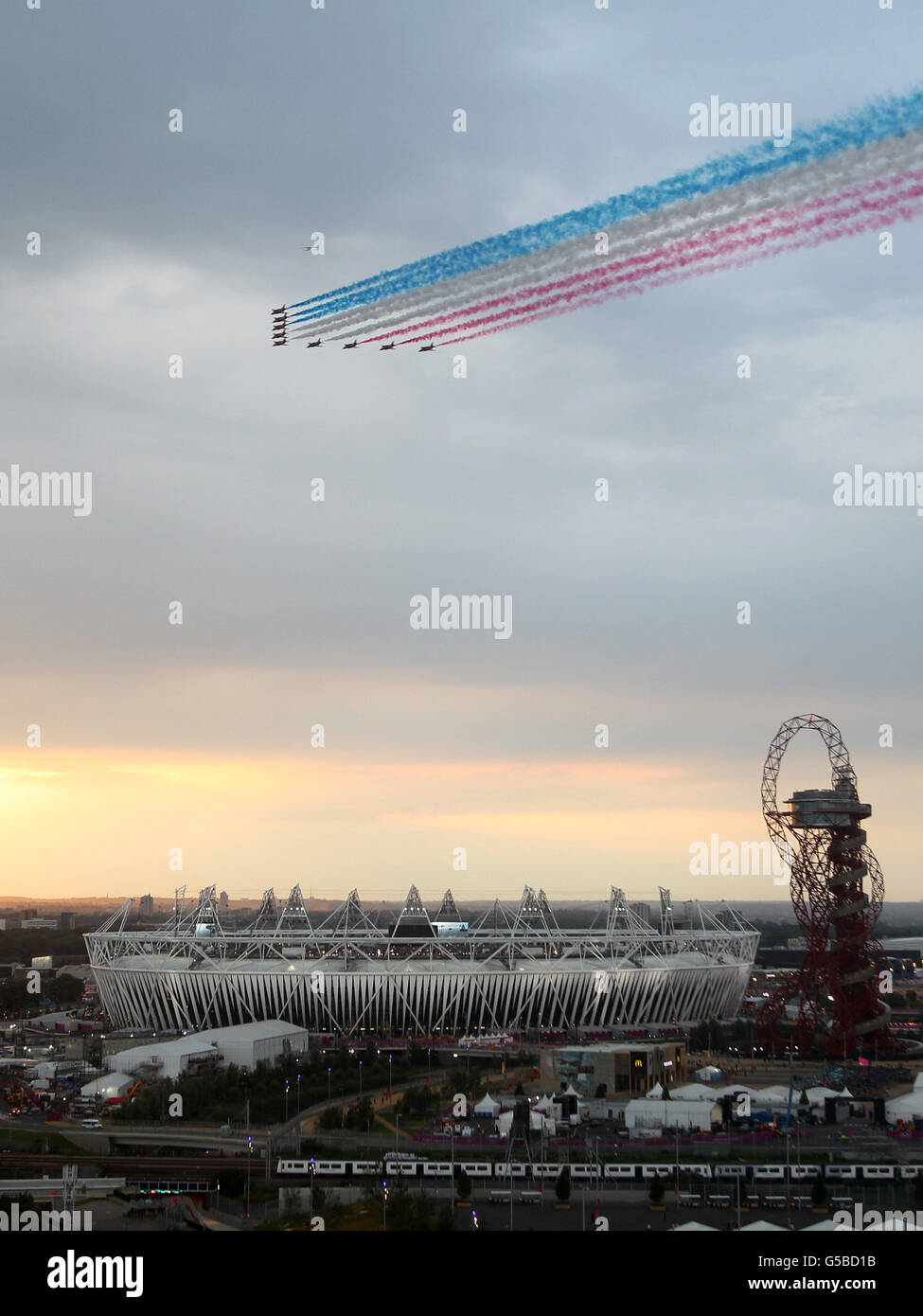 The Red Arrows perform a flypast over the Olympic Park in London ahead ...