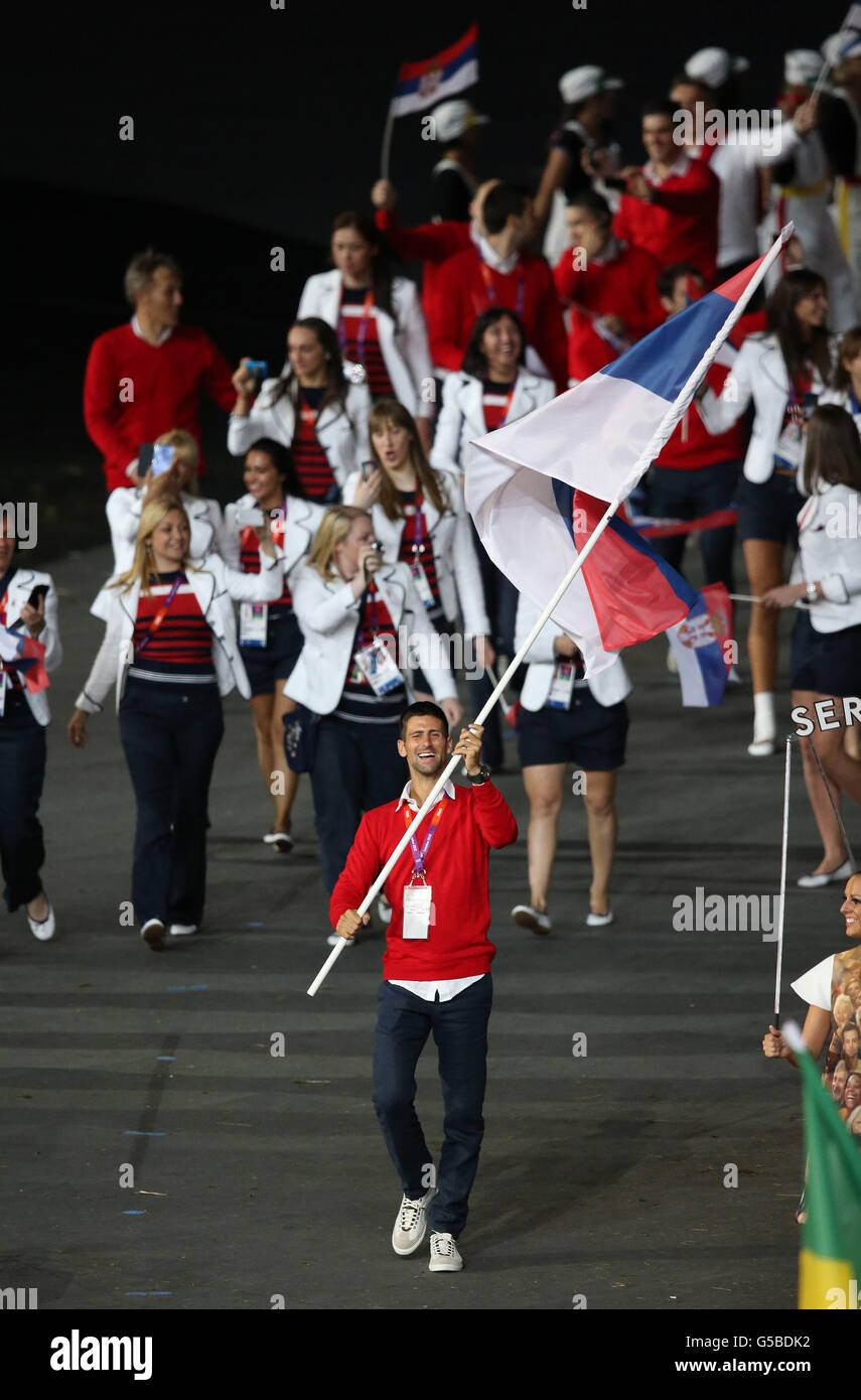 Serbia's Novak Djokovic holds his counties flag at the Opening Ceremony ...