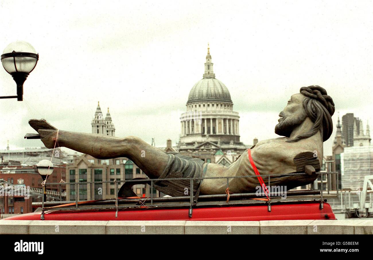 An 18 foot 6 inch statue of the crucified Christ travels on the roof of ...