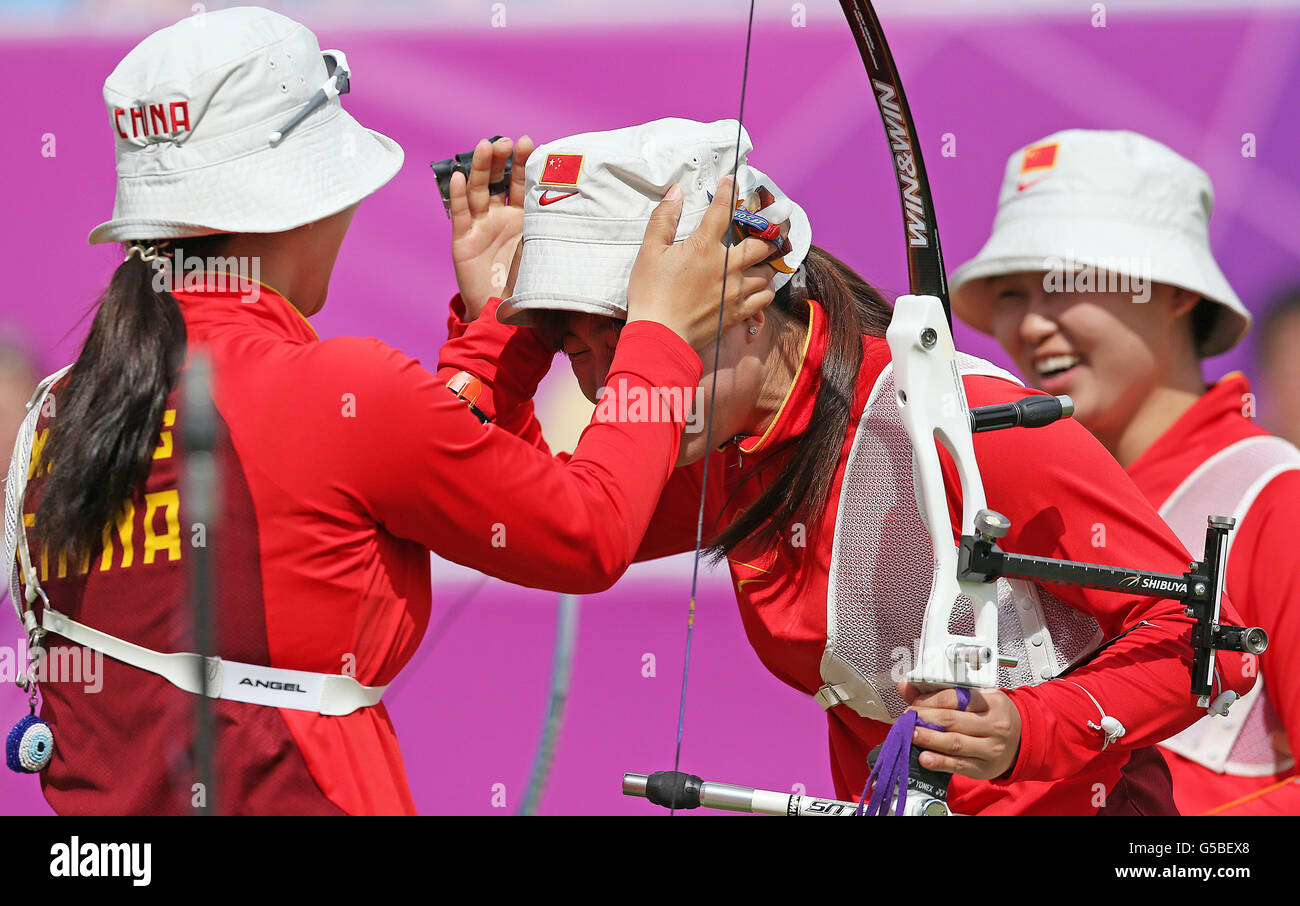 China's Yuting Fang (centre) celebrates with her team mates after ...