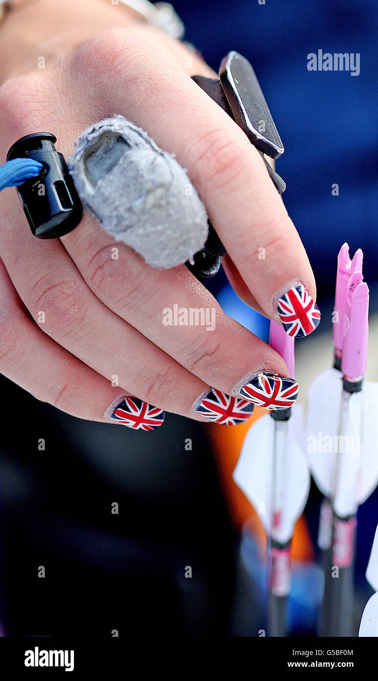 Great Britain's Alison Williamson painted fingernails as she selects an ...
