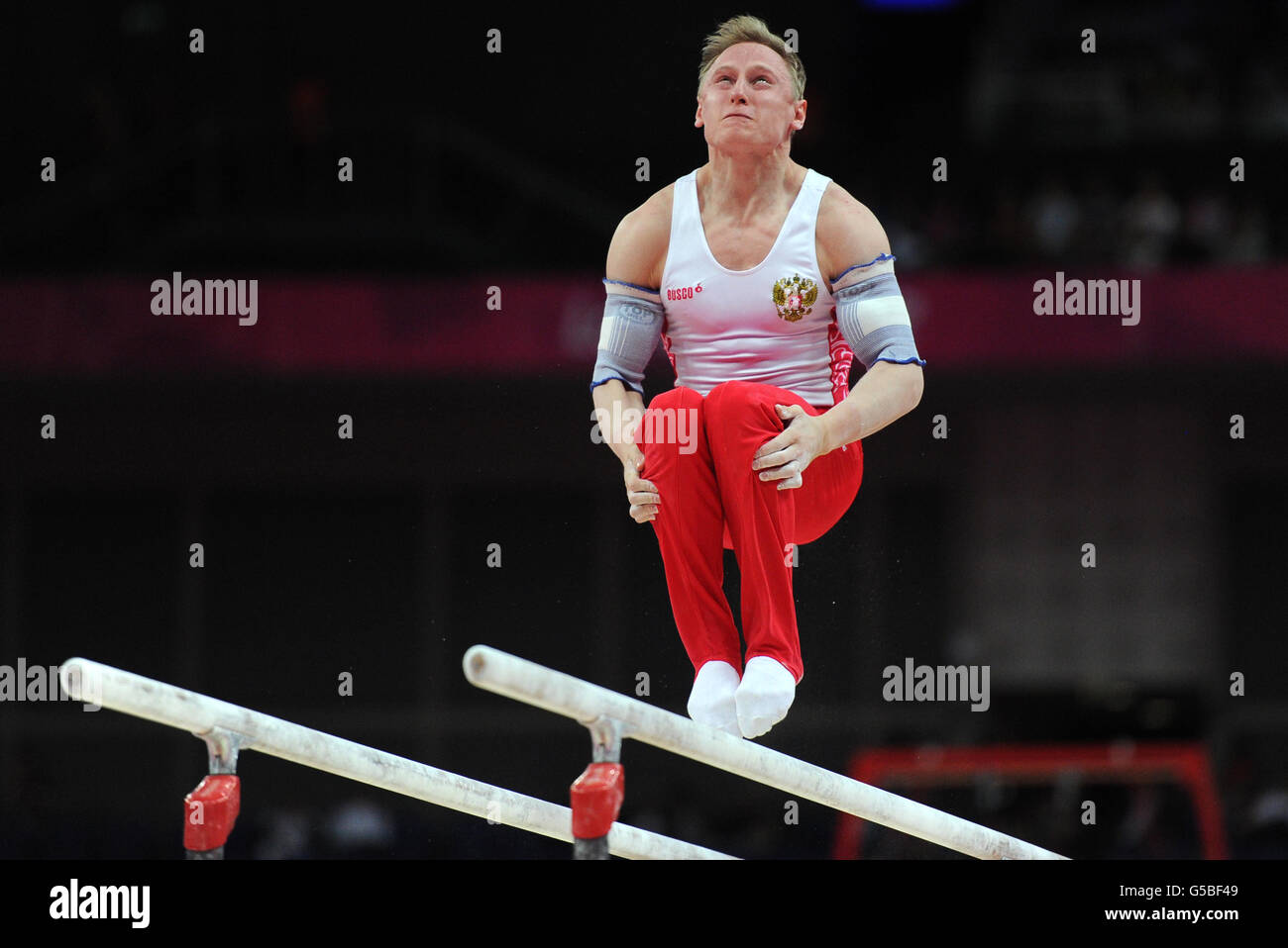 Russia's Aleksandr Balandin competes on the parallel bars during the ...