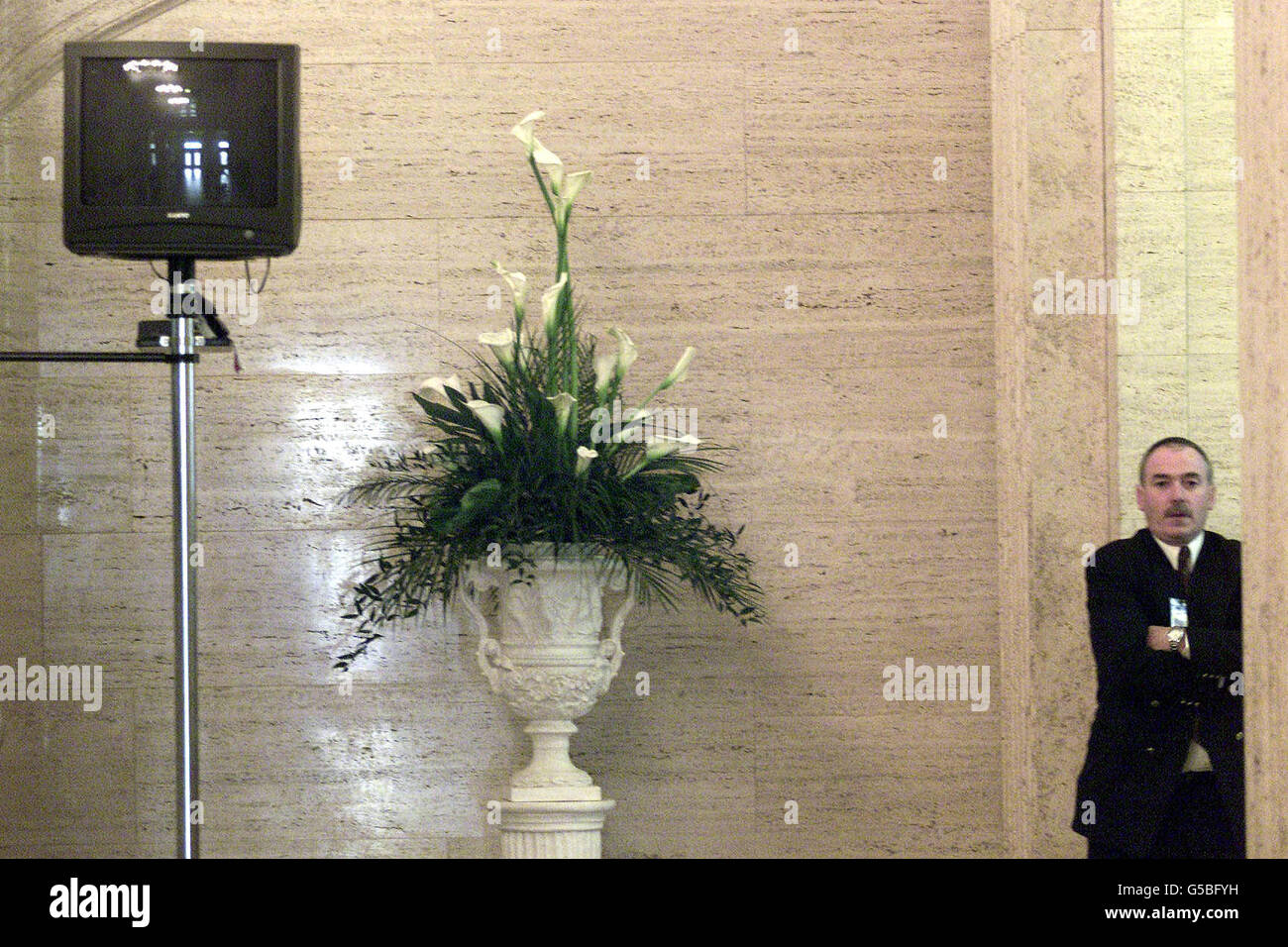 A Stormont security offical guards the Easter Lillys on display in the ...
