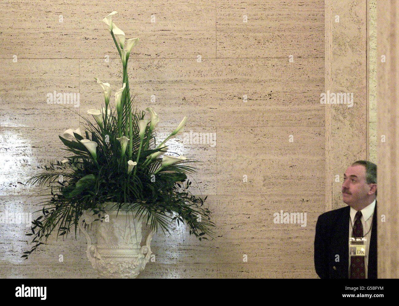 A Stormont security offical guards the Easter Lillys on display in the ...