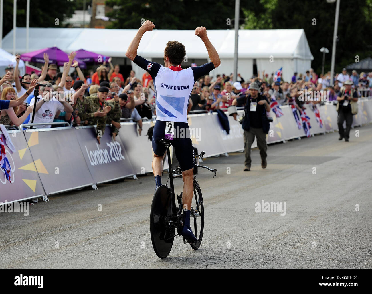 Great Britain's Bradley Wiggins celebrates winning the Men's Individual ...