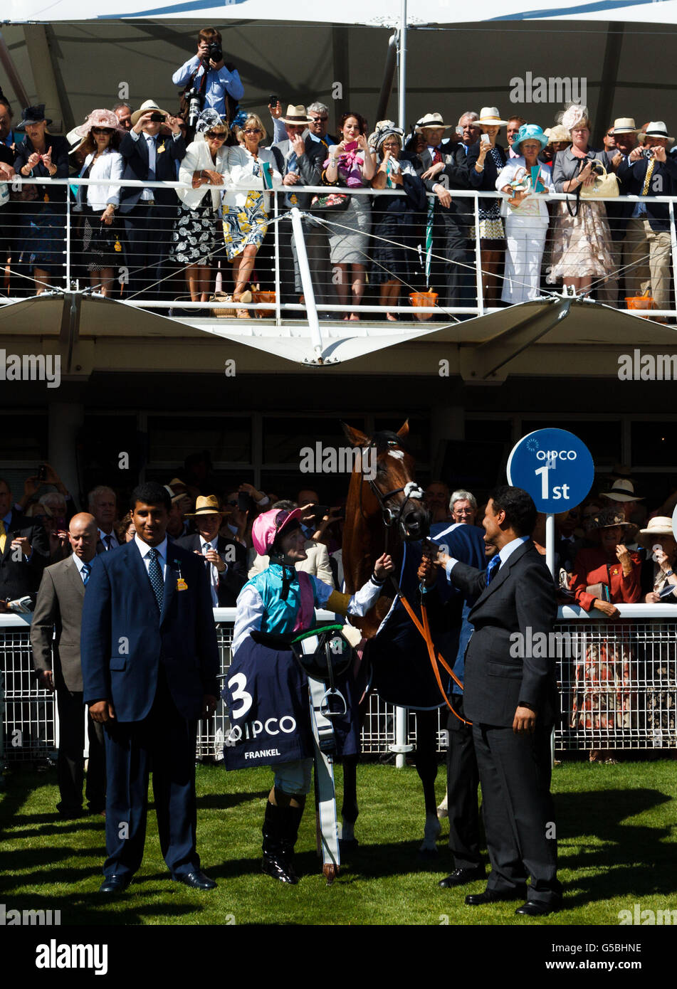 Tom Queally poses with Frankel in the winners enclosure after winning ...
