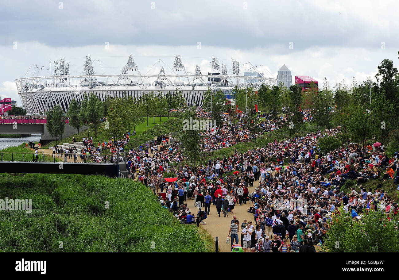 Fans walk near the Olympic Stadium as they take their seats to watch ...