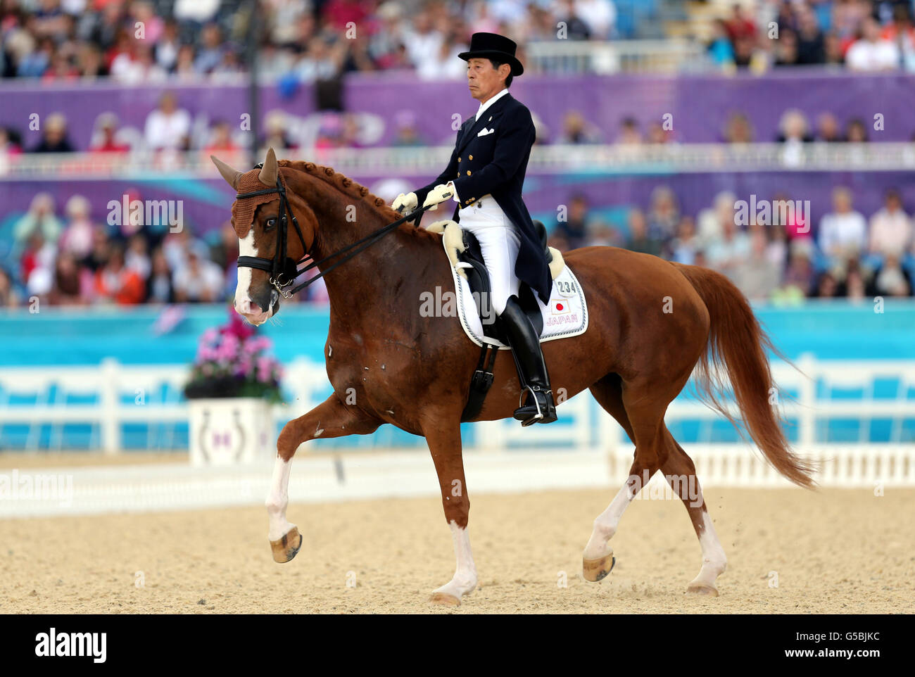 Japan's 71 year-old Hiroshi Hoketsu riding Whisper as he competes in ...